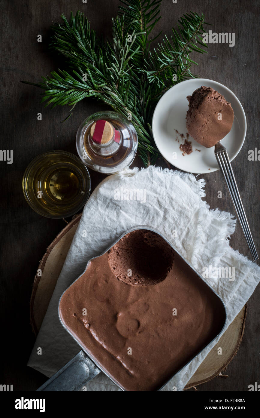 Single malt & chocolate mousse in vintage tin pot on dark wooden ground ...