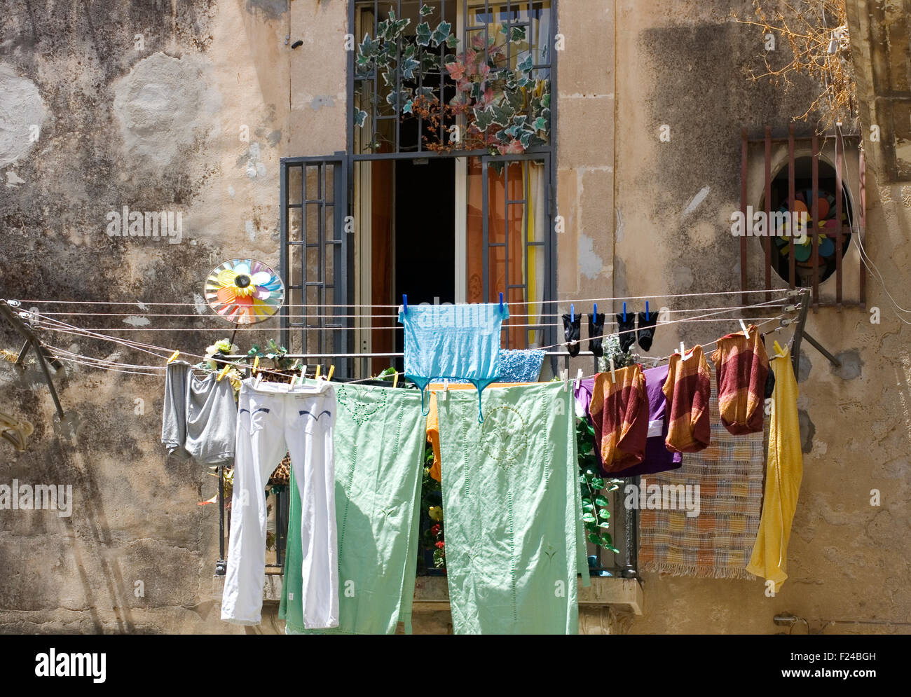 Drying laundry out of the balcony Stock Photo - Alamy