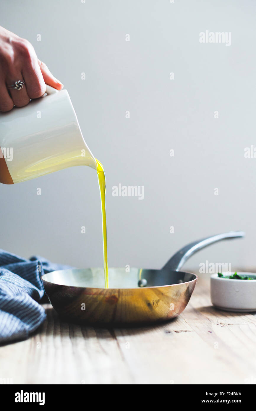 Cooking oil pouring in pan hi-res stock photography and images - Alamy