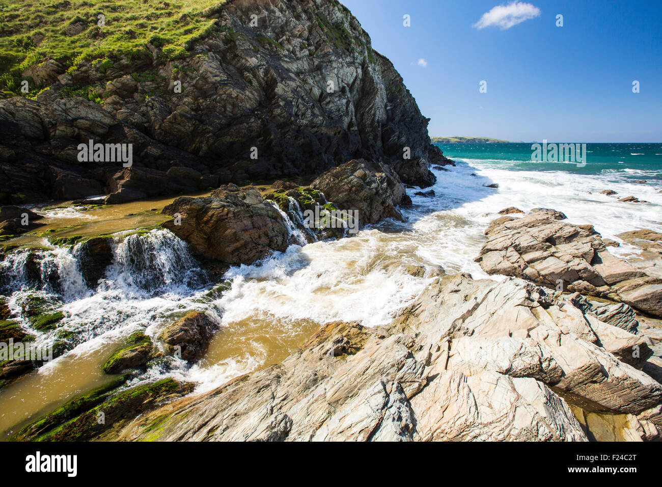 Sea cliffs and a stream entering the sea at Barrets Zawn near Port ...