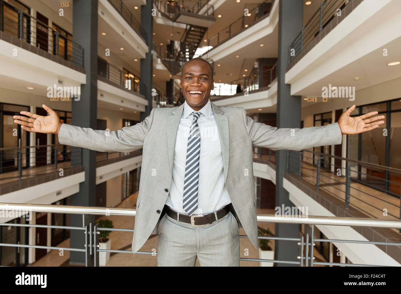 Black man arms outstretched suit hi-res stock photography and images ...