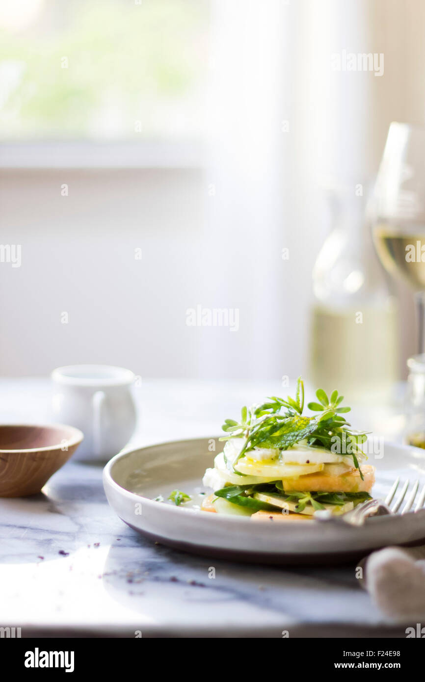 Cucumber melon caprese salad with rocket and purslane Stock Photo - Alamy