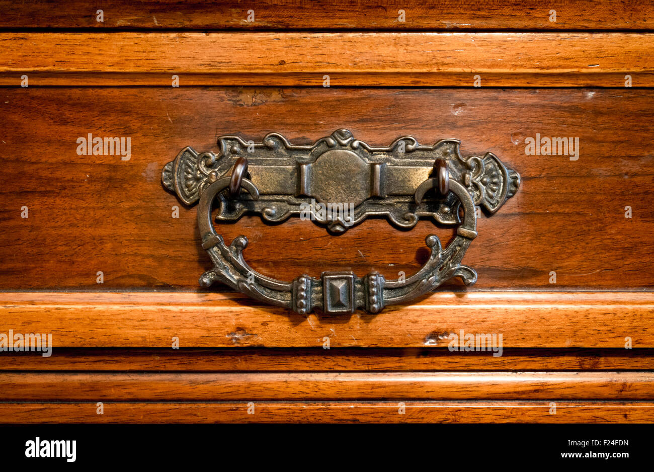 Brass handle hand made of the drawer of an antique furniture Stock ...