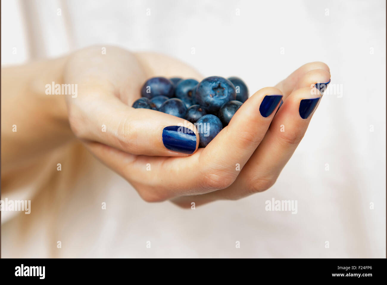 closeup of woman's hand full of blueberries Stock Photo - Alamy