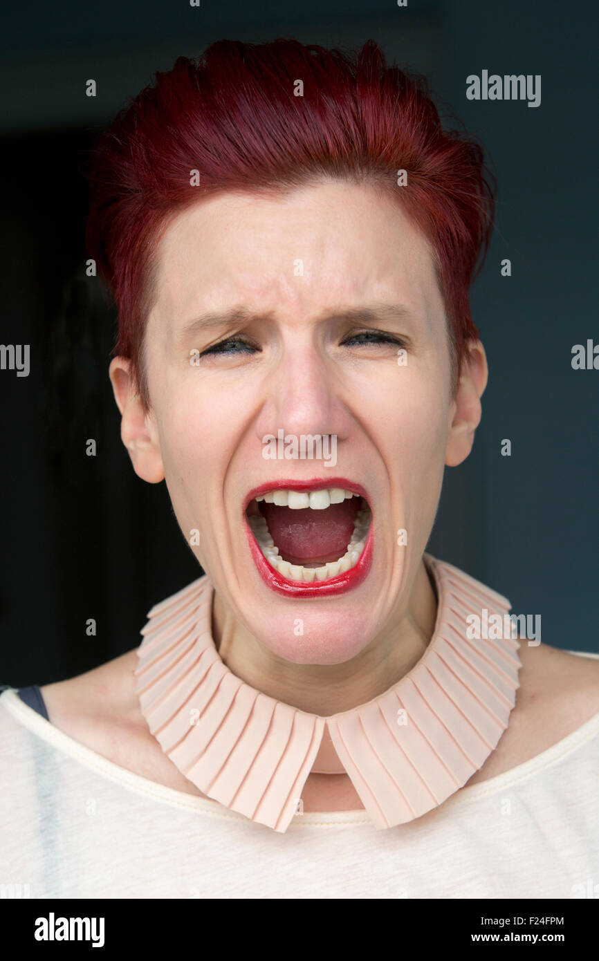 portrait of beautiful red-haired woman screaming Stock Photo - Alamy