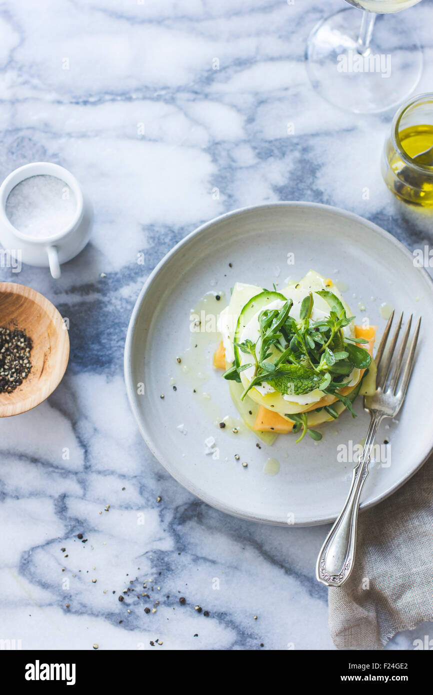 Cucumber melon caprese salad with rocket and purslane Stock Photo - Alamy