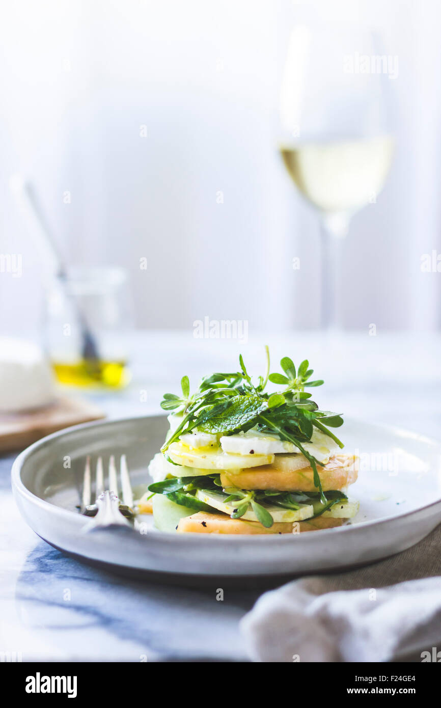 Cucumber melon caprese salad with rocket and purslane Stock Photo - Alamy