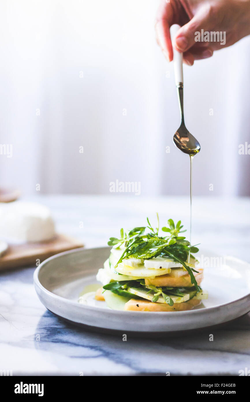 Cucumber melon caprese salad with rocket and purslane Stock Photo - Alamy