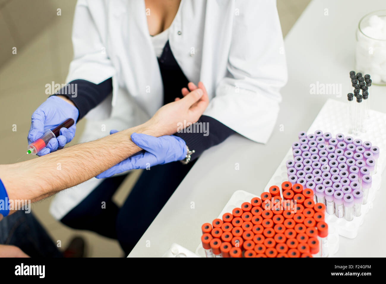 Taking blood in laboratory Stock Photo - Alamy