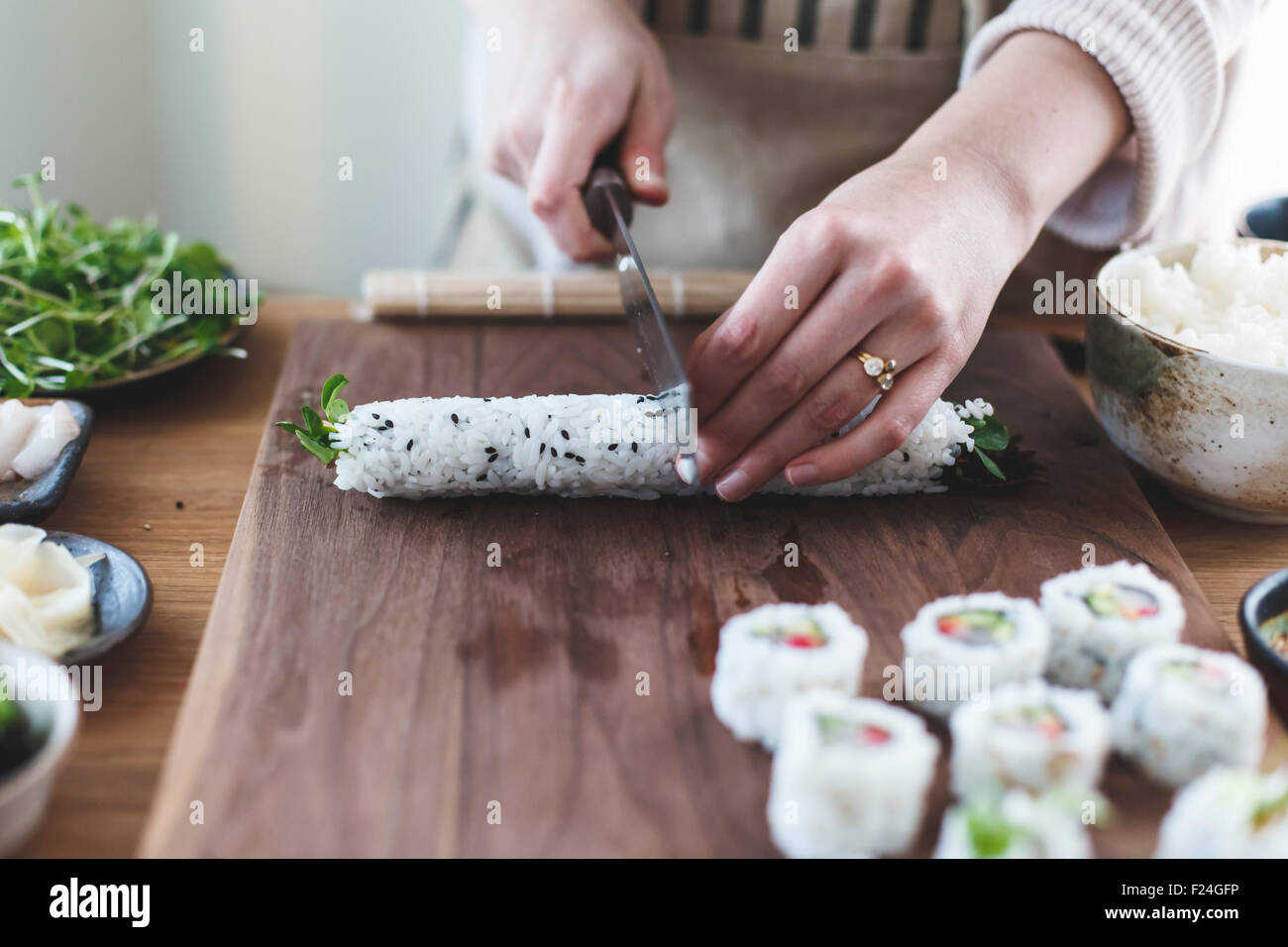 The making of sushi. Rolled sushi preparation Stock Photo - Alamy
