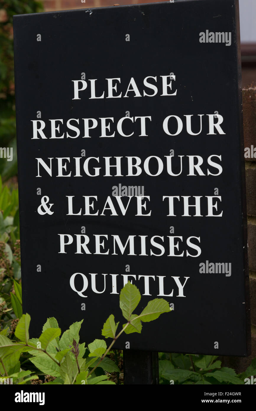 A sign asking guests to respect the neighbours and leave a premises ...