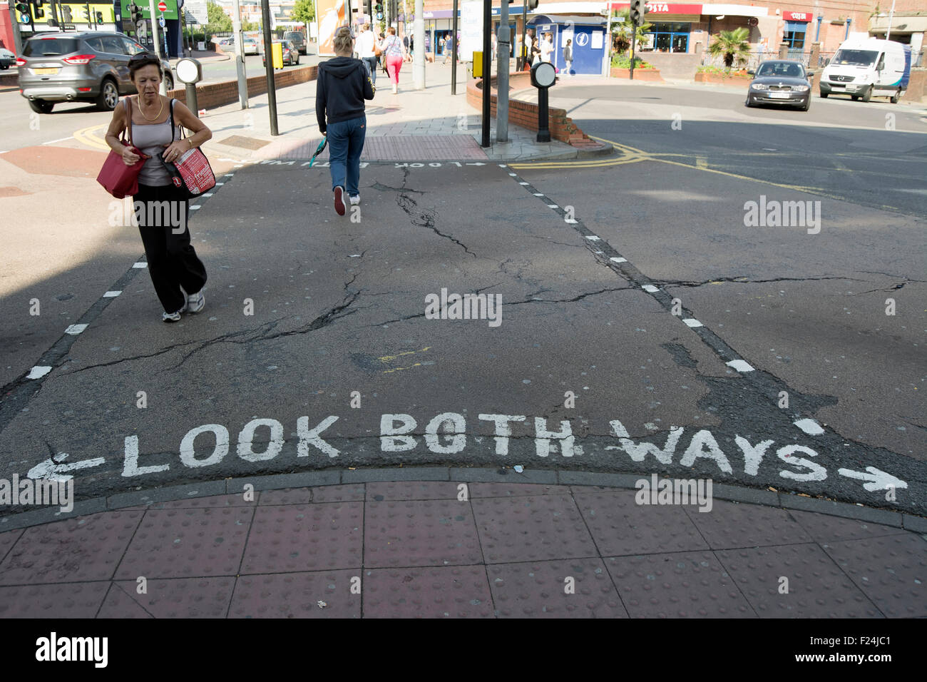 look both ways road marking with people crossing road in kingston upon ...