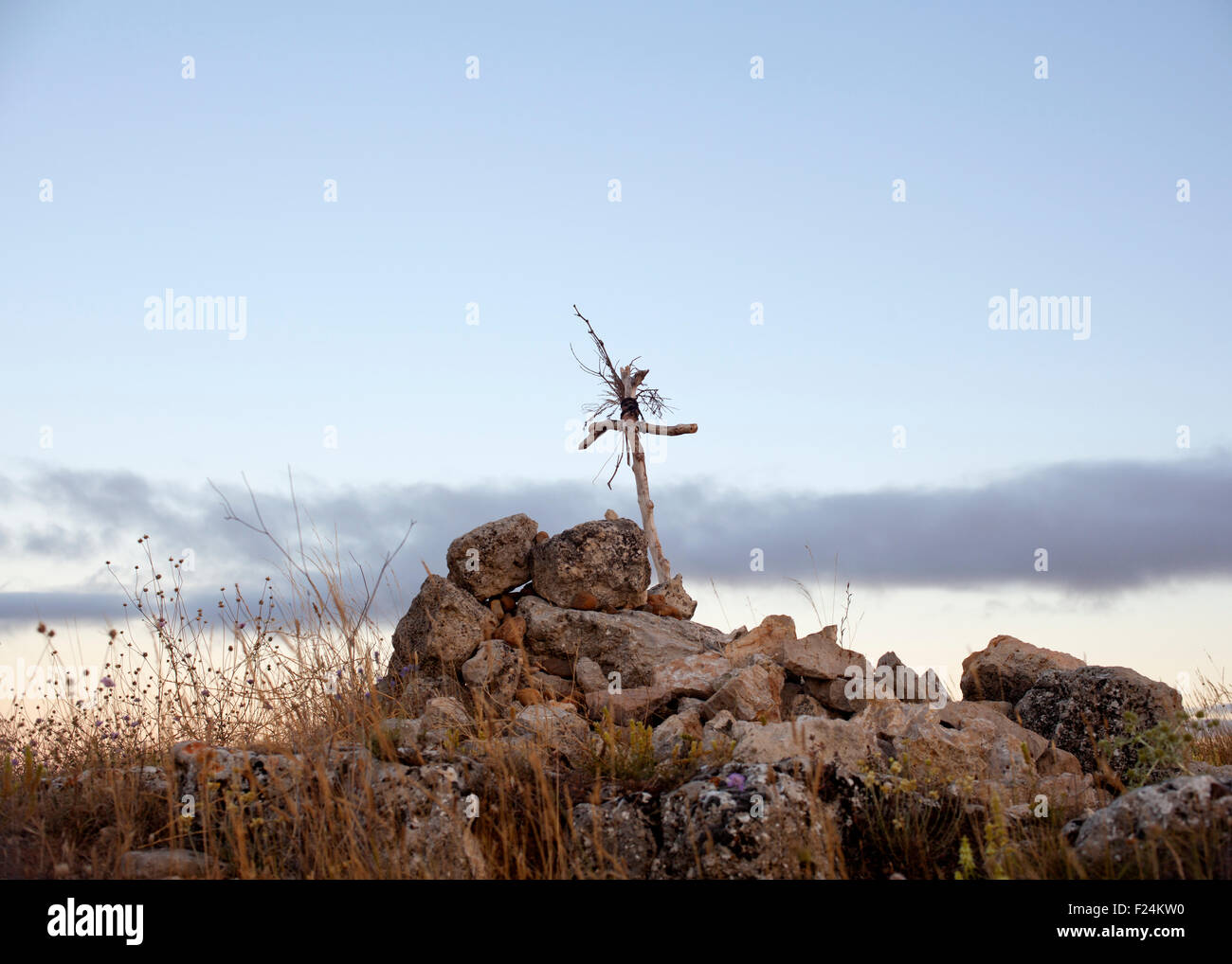 Cross built with branches in a countryside Stock Photo - Alamy