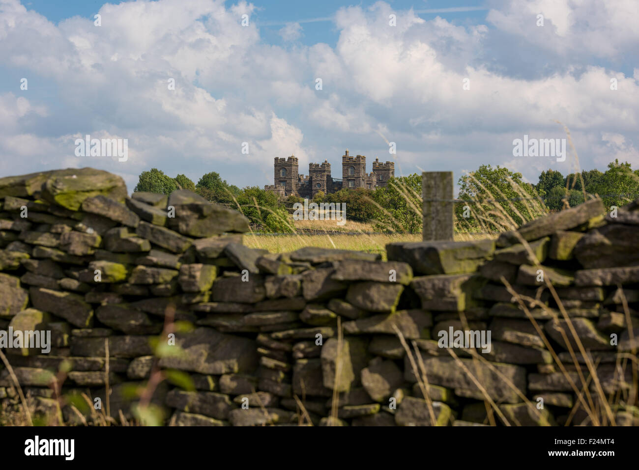 Riber Castle in the distance looking over a dry stone wall in Matlock ...