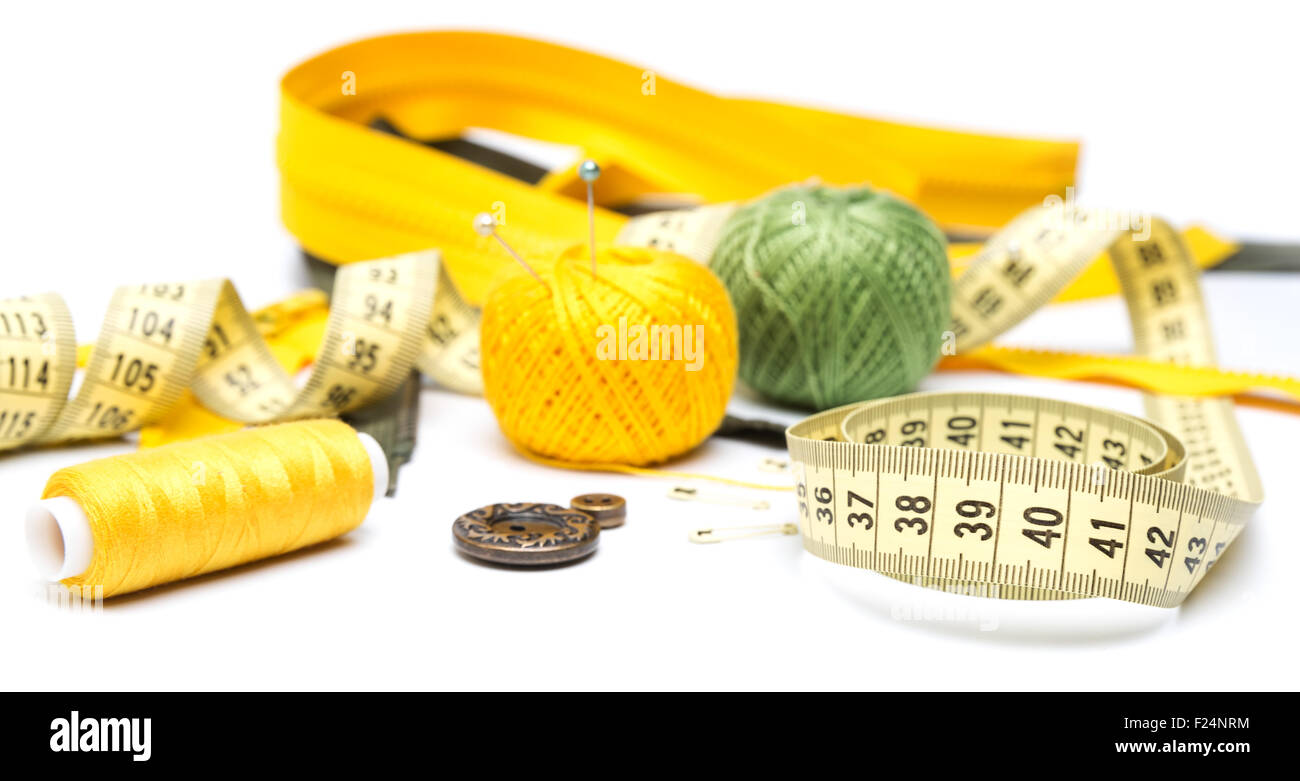 bunch of various sewing accessories - yellow measuring tape skeins ...