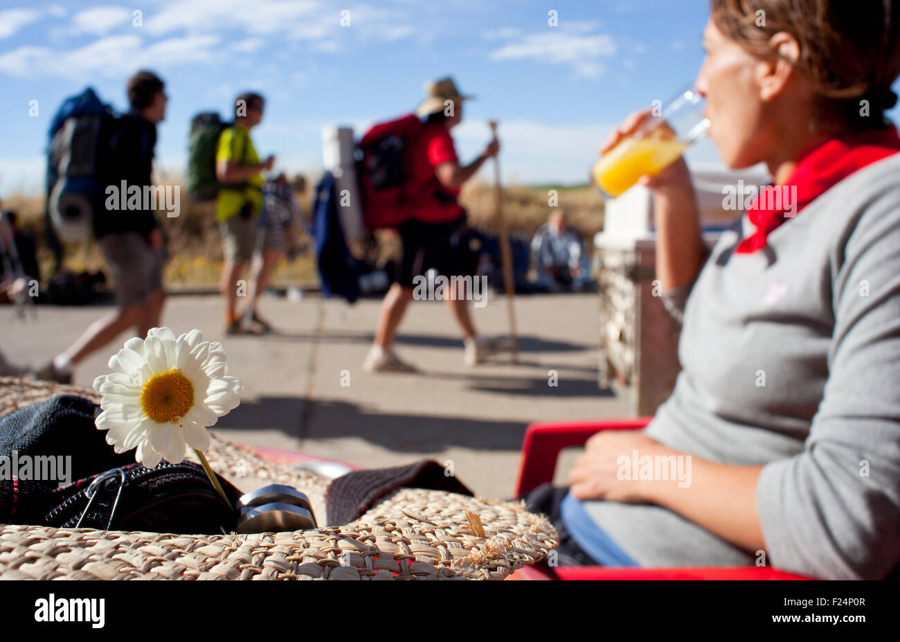 Pilgrim drinks juice. Way of St. James Stock Photo - Alamy