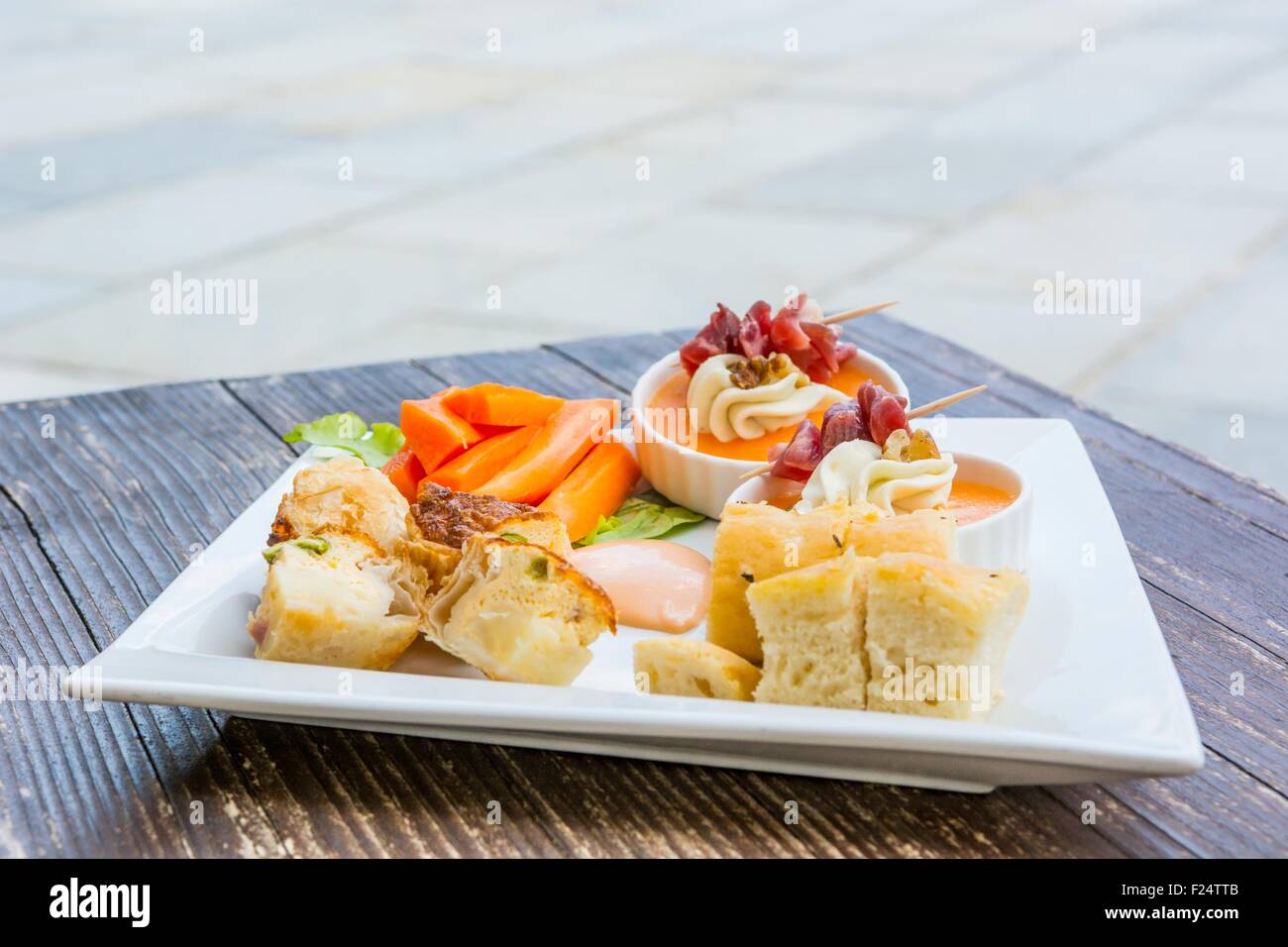 Finger food on wooden table Stock Photo - Alamy