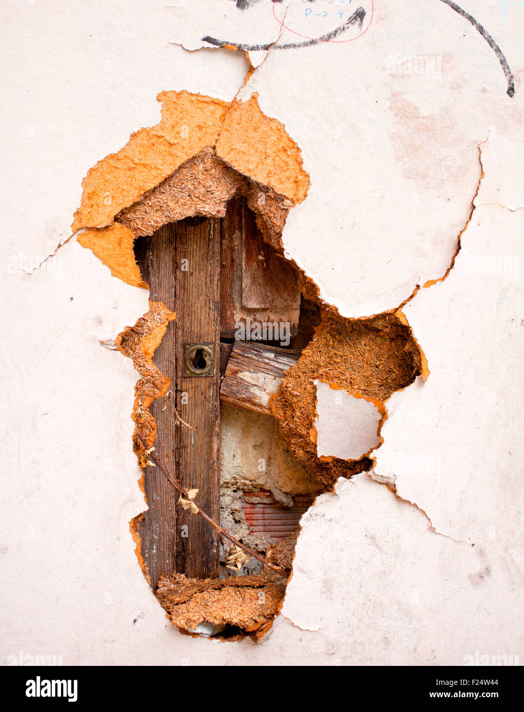 Door behind a broken wall Stock Photo - Alamy