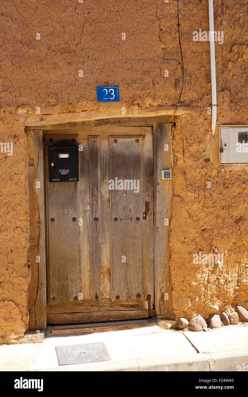 Old door of a poor house Stock Photo - Alamy