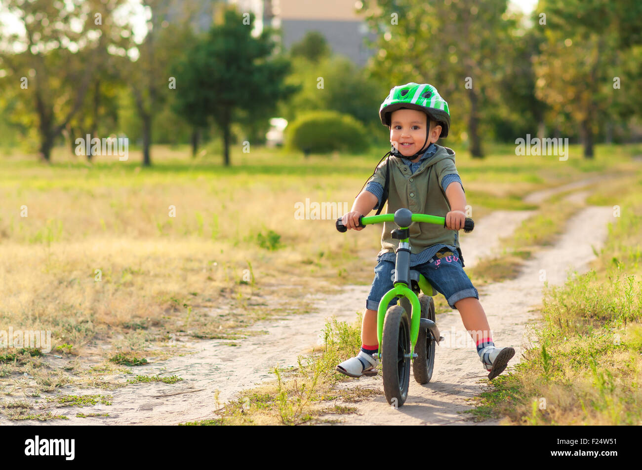 The child riding a bicycle Stock Photo - Alamy