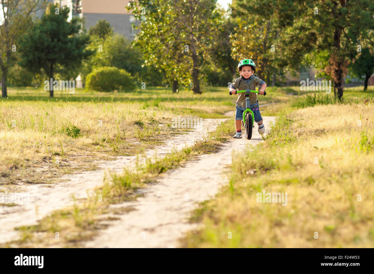 The child riding a bicycle Stock Photo - Alamy