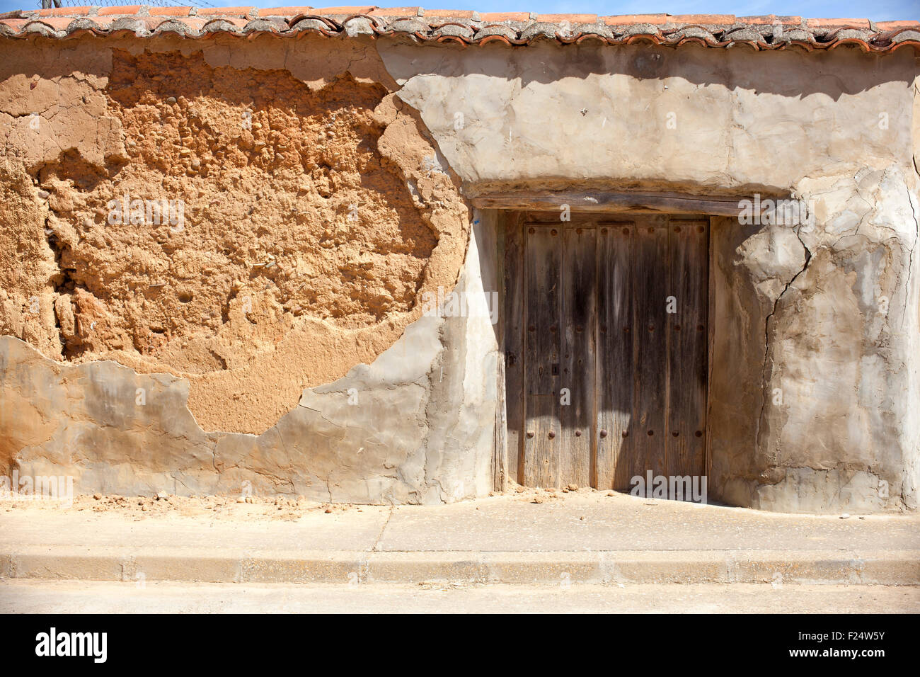 Old door of a poor house Stock Photo - Alamy