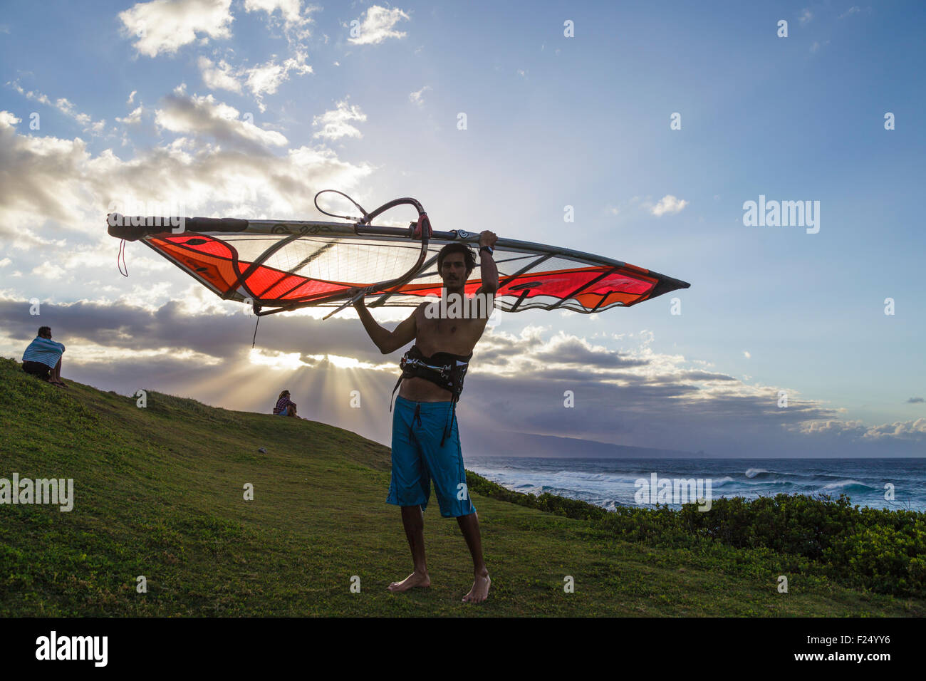 Windsurfer and spectators at Hookipa Beach Park on Maui at sunset Stock ...