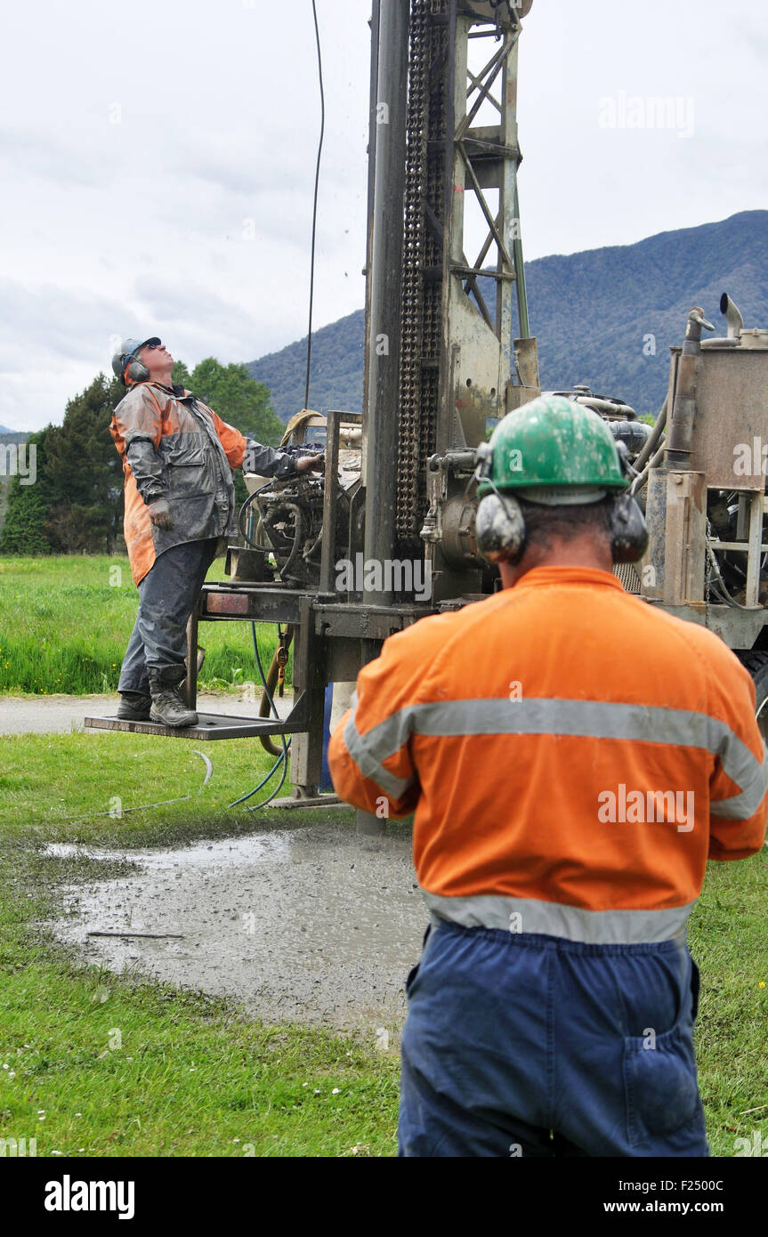 Crew working a drilling rig in the search for bore water, Westland ...