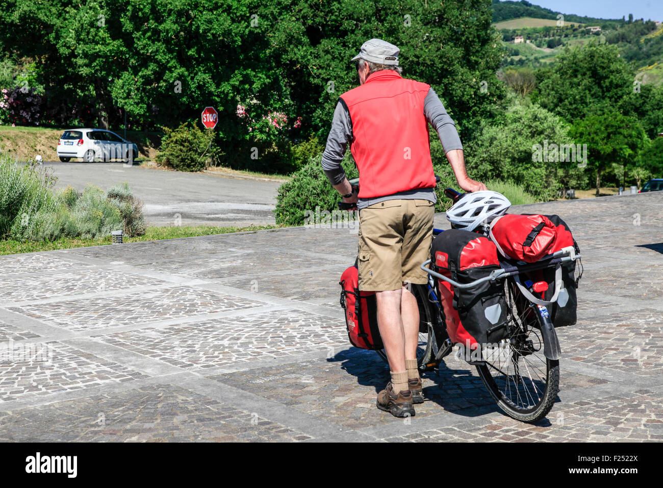A traveller and his bicycle packet with camping equipment Stock Photo ...