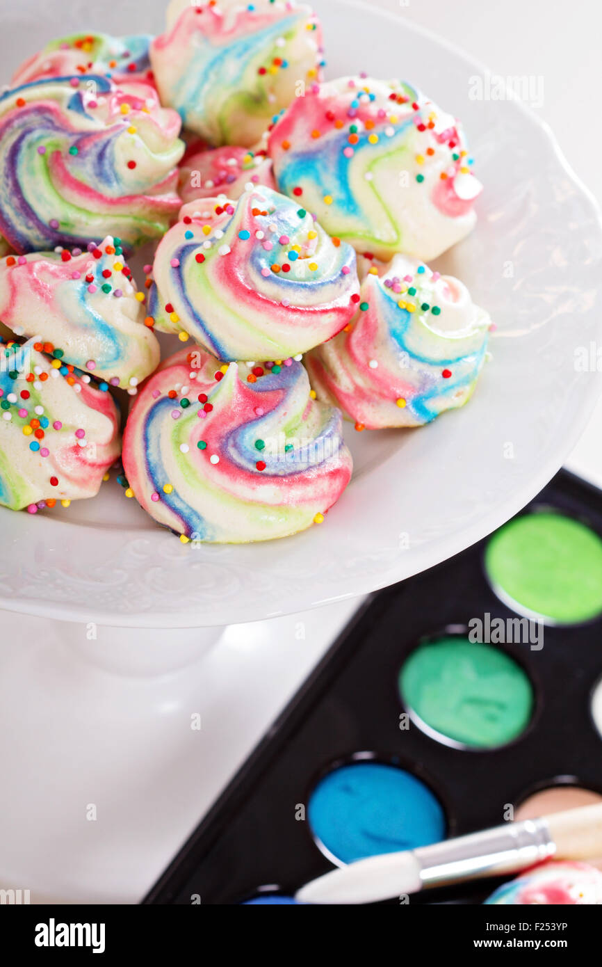 Colorful meringues painted rainbow colors with sprinkles Stock Photo ...