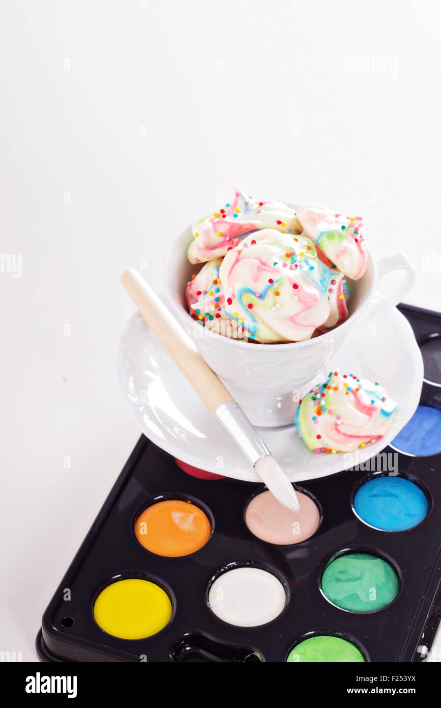 Colorful meringues painted rainbow colors with sprinkles Stock Photo ...