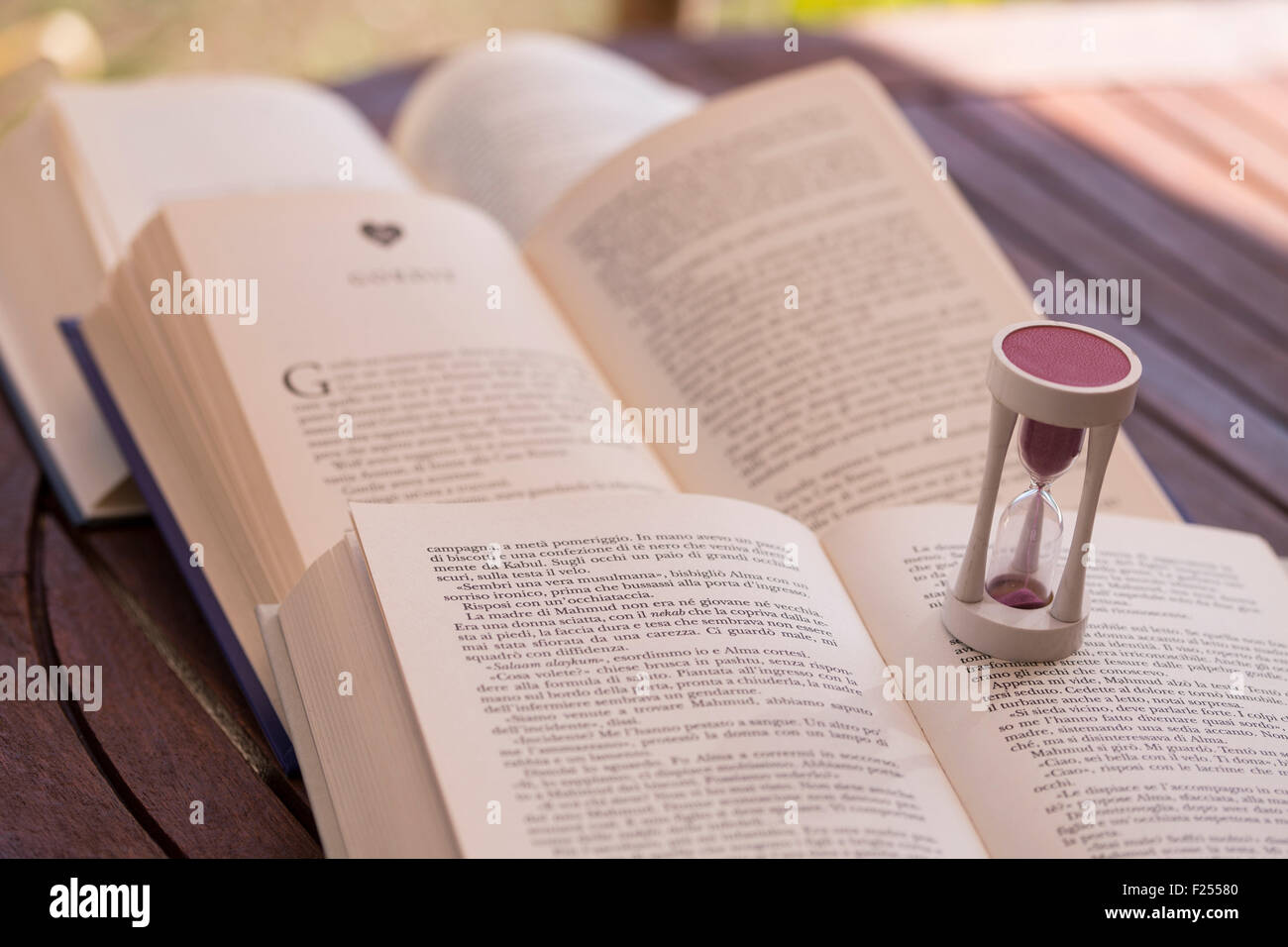 Hourglass book hi-res stock photography and images - Alamy