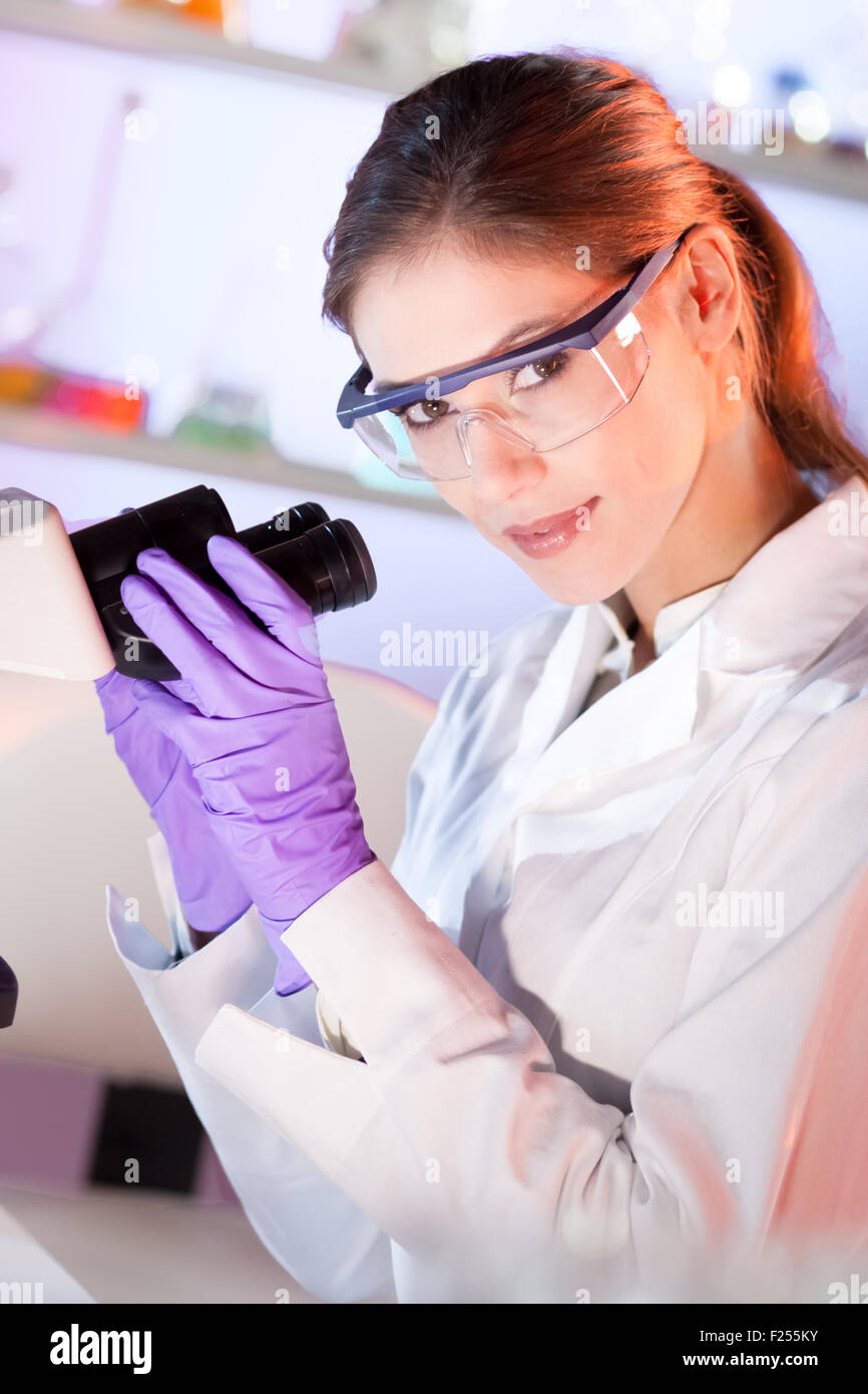 Portrait of a helth care professional microscoping Stock Photo - Alamy