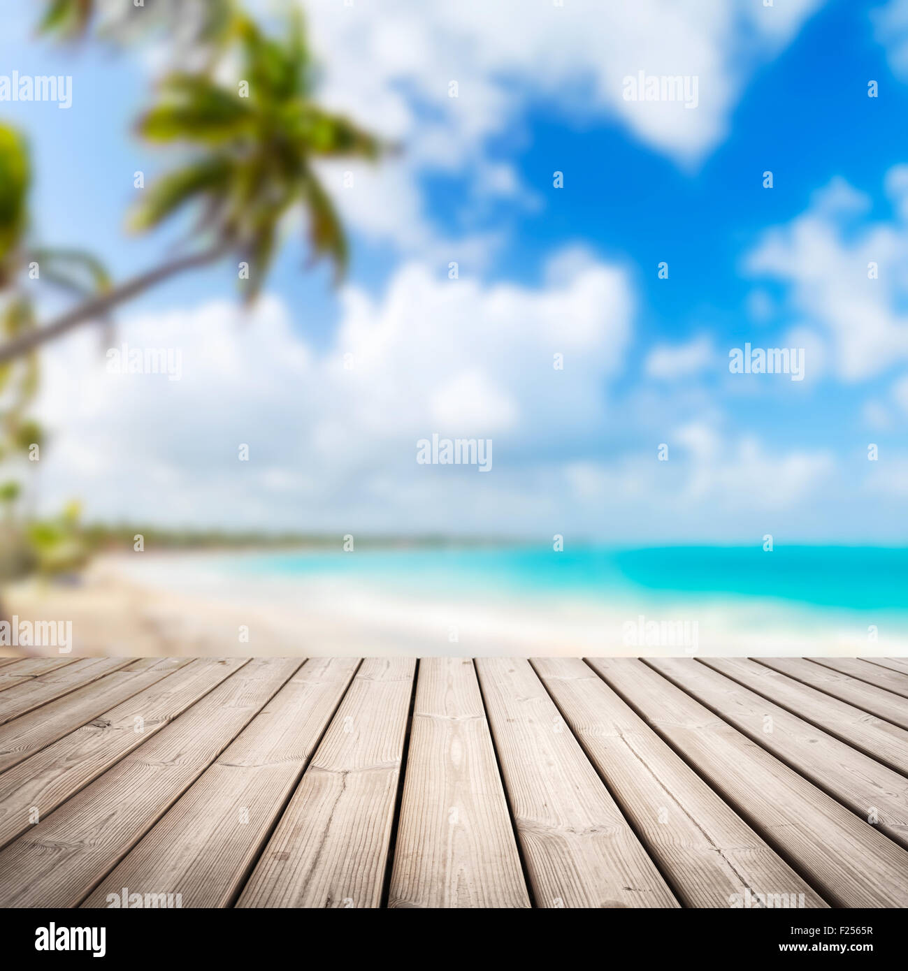 Empty wooden pier background over blurred tropical beach coastal ...