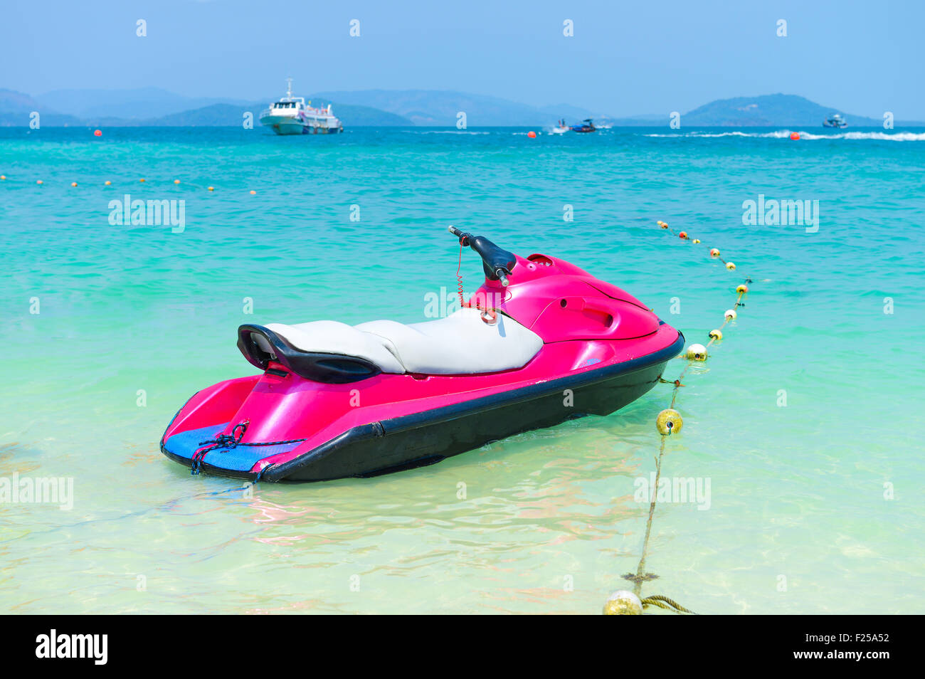 Magenta Jet ski on the beach of Andaman Sea in summer vacation at Khai ...