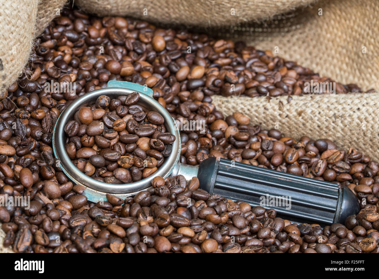 arm of coffee machine in coffee beans Stock Photo - Alamy