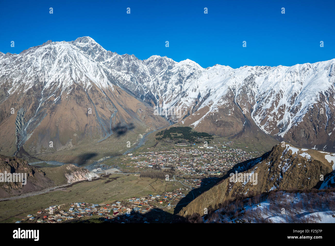 Aerial view on Gergeti village and Stepantsminda town (formerly Kazbegi ...