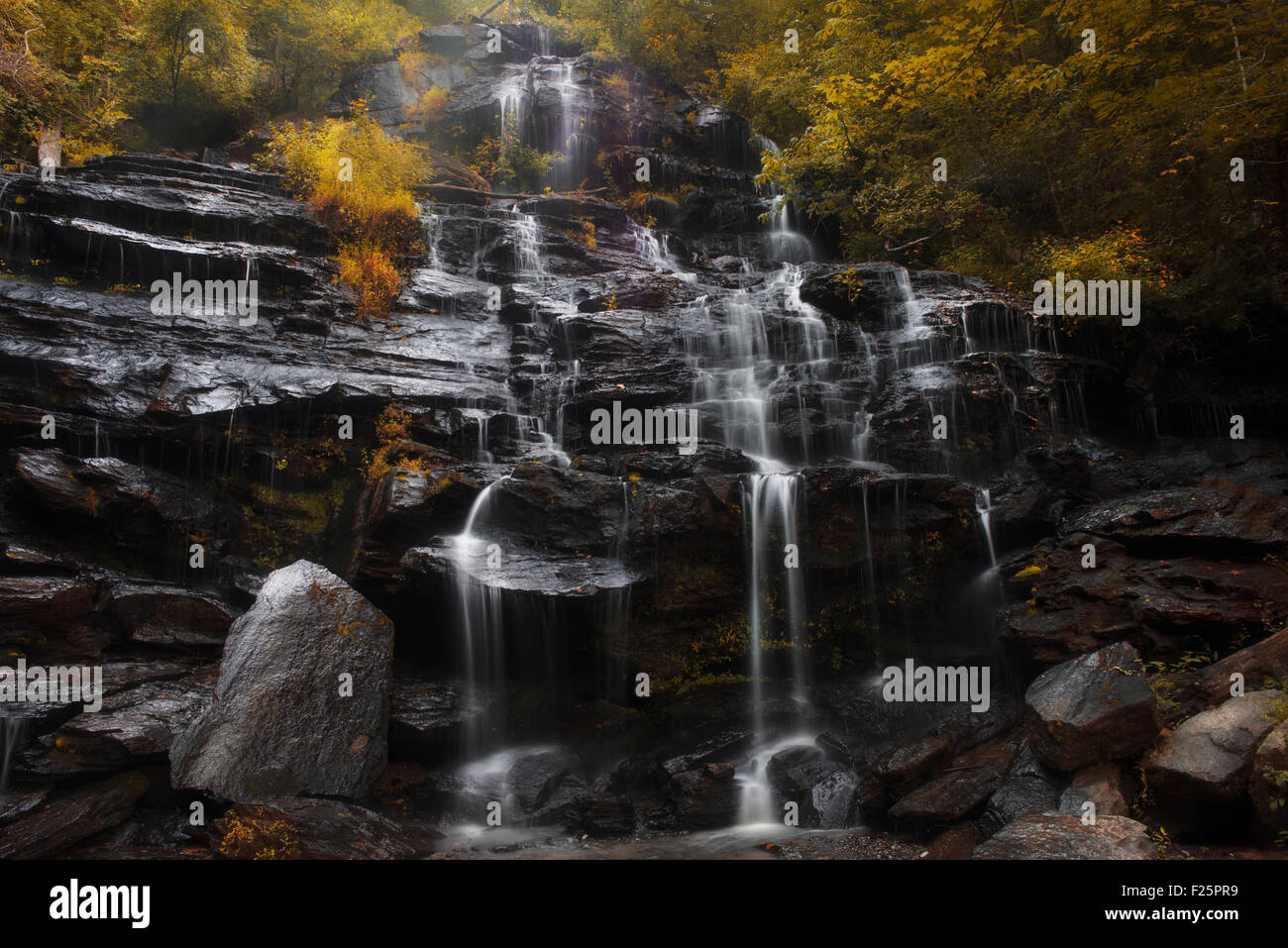 Beautiful cascading waterfall with autumn foliage, long exposure ...
