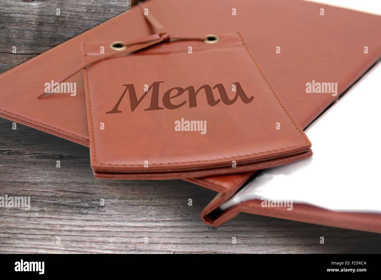 brown leather menu in a restaurant or café on wooden background Stock ...