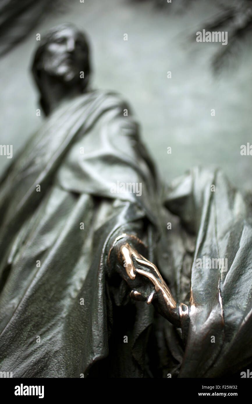 Virgin Mary touching hand of Jesus - Sculpture on the bronze portal ...