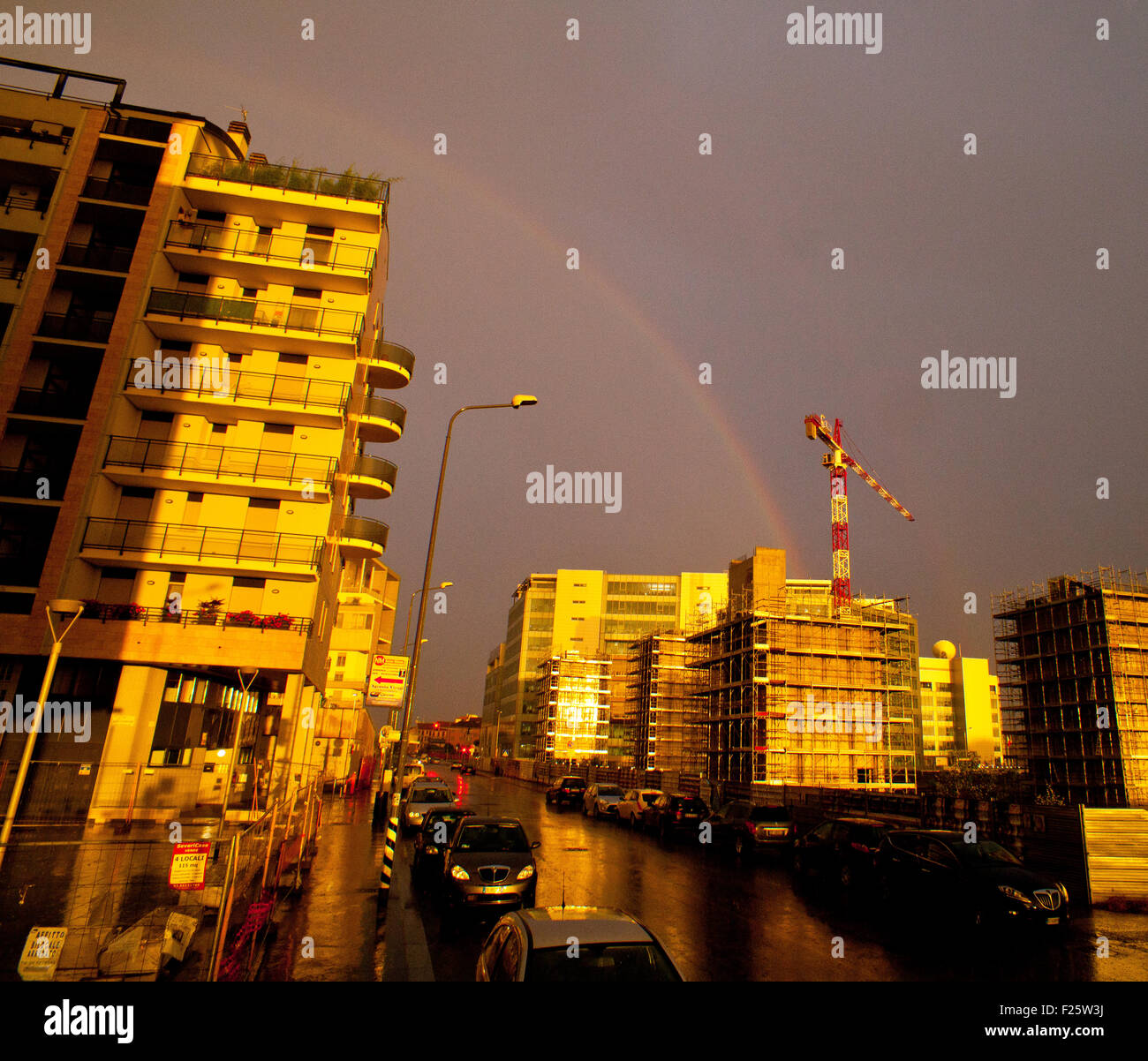 Rainbow in the city, Milan - Italy Stock Photo - Alamy