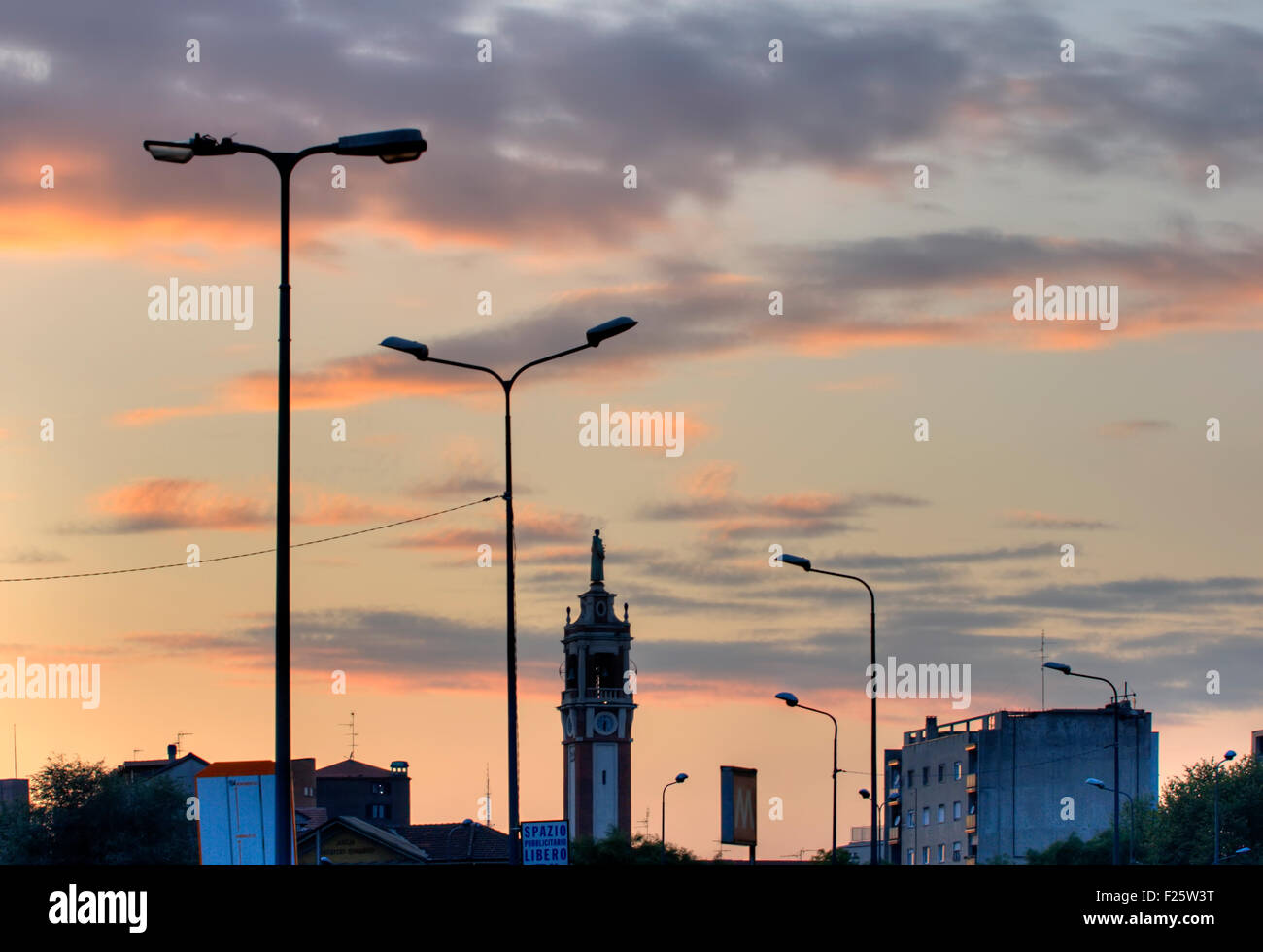 Street lights and bell tower, Milan - Italy Stock Photo - Alamy