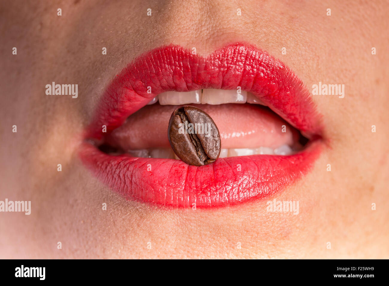 coffee beans between lips Stock Photo - Alamy