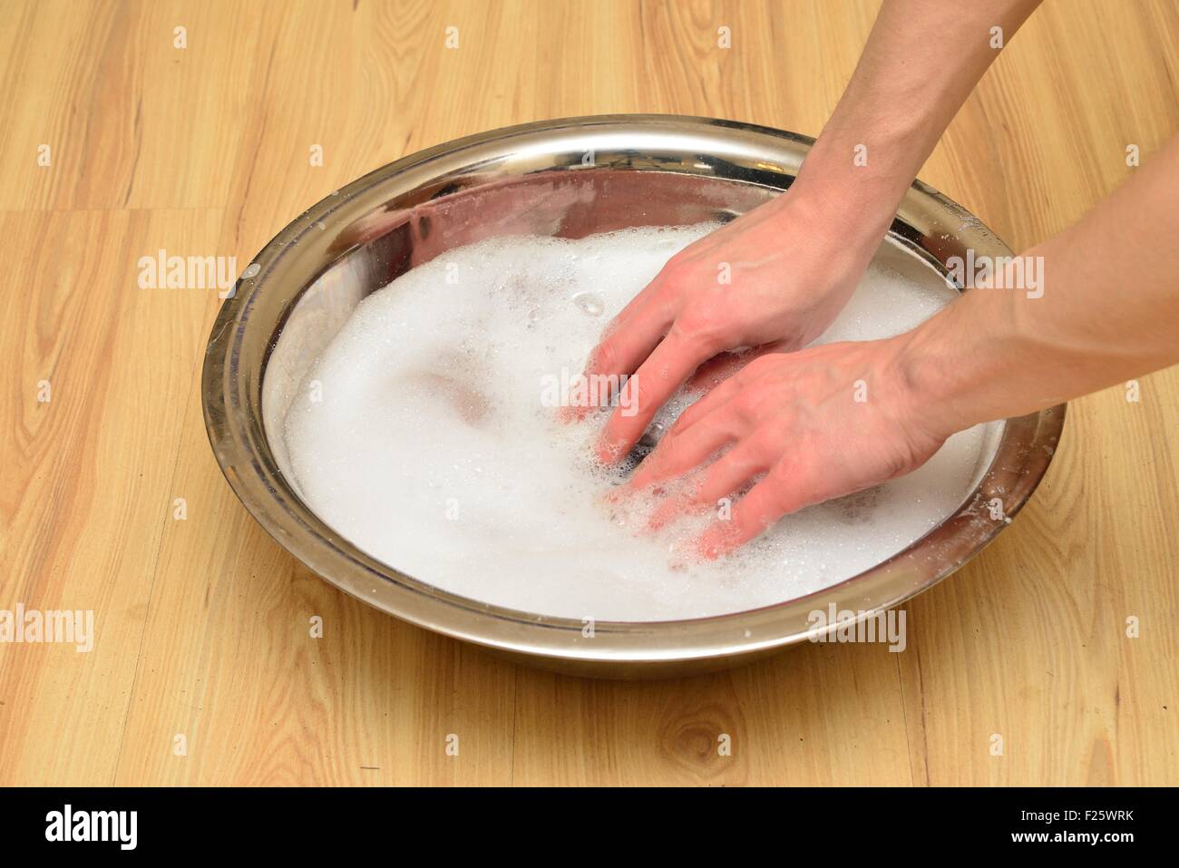 wash sweaters in metal basin with foam and soap Stock Photo - Alamy