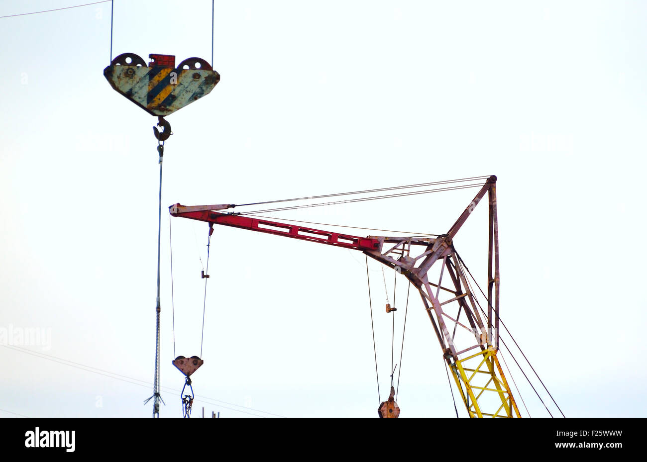 color parts of building crane over blue sky Stock Photo - Alamy