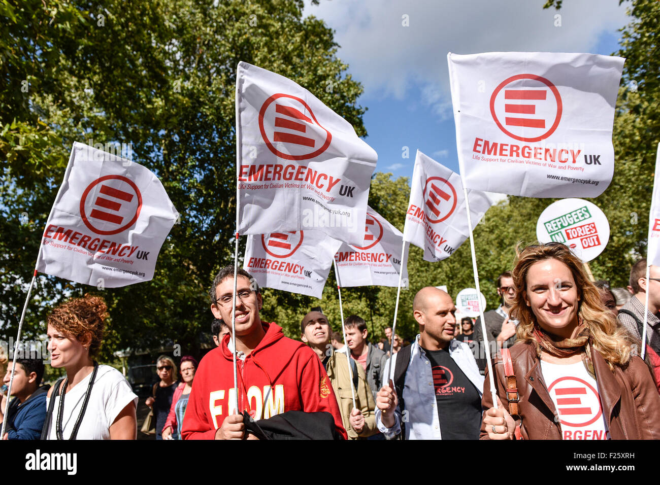 London, UK. 12th September 2015. Colourful flags held aloft by ...