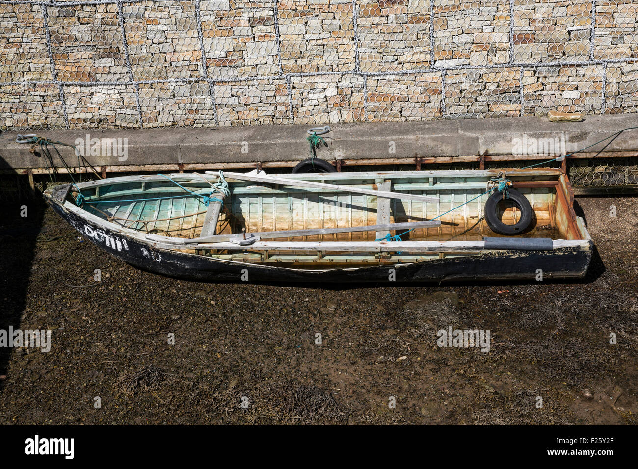 A currach fishing boat in the harbour at Claddaghduff, Connemara ...