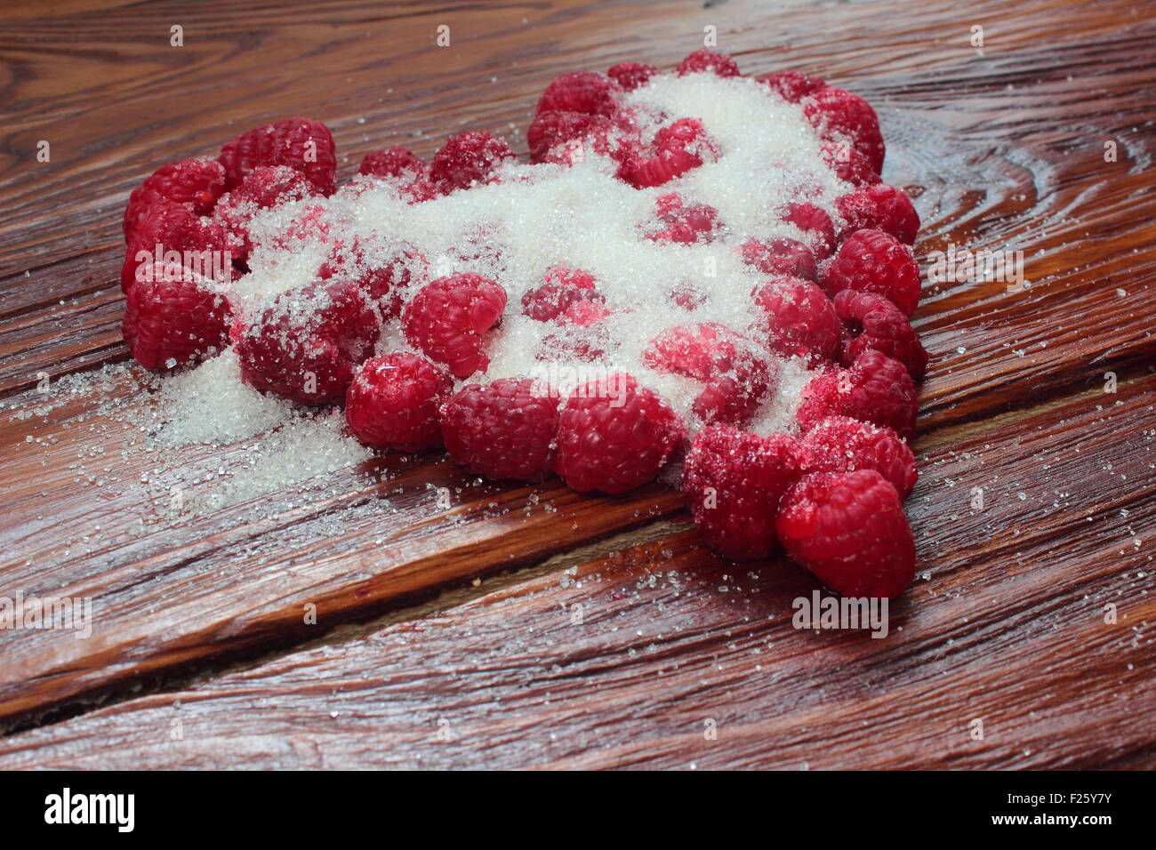 Heart laid out from a raspberry sugar Stock Photo - Alamy