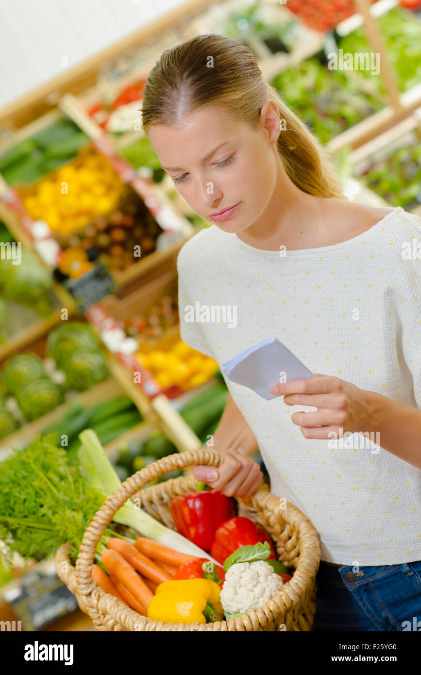 Woman checking her shopping list Stock Photo - Alamy