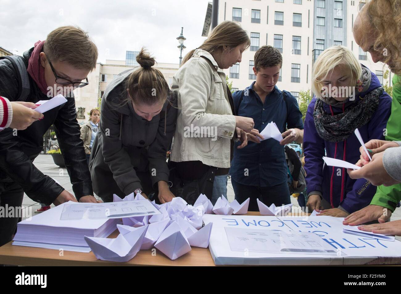 Vilnius, Lithuania. 12th Sep, 2015. People make paper boats during an ...